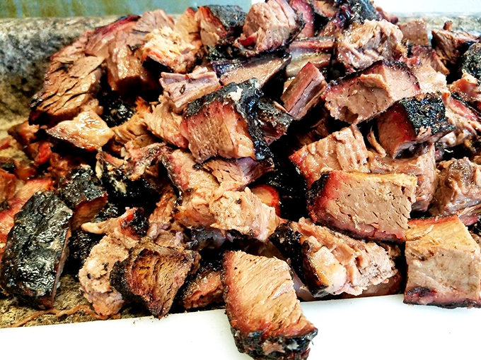 Burnt ends—barbecue's greatest magic trick. Transforming the toughest part of the brisket into caramelized cubes of flavor that would make a vegetarian reconsider life choices.