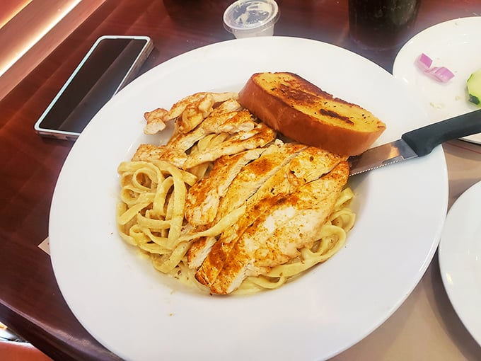 Fettuccine Alfredo with grilled chicken that would make an Italian grandmother nod in approval—simple perfection on a plate.