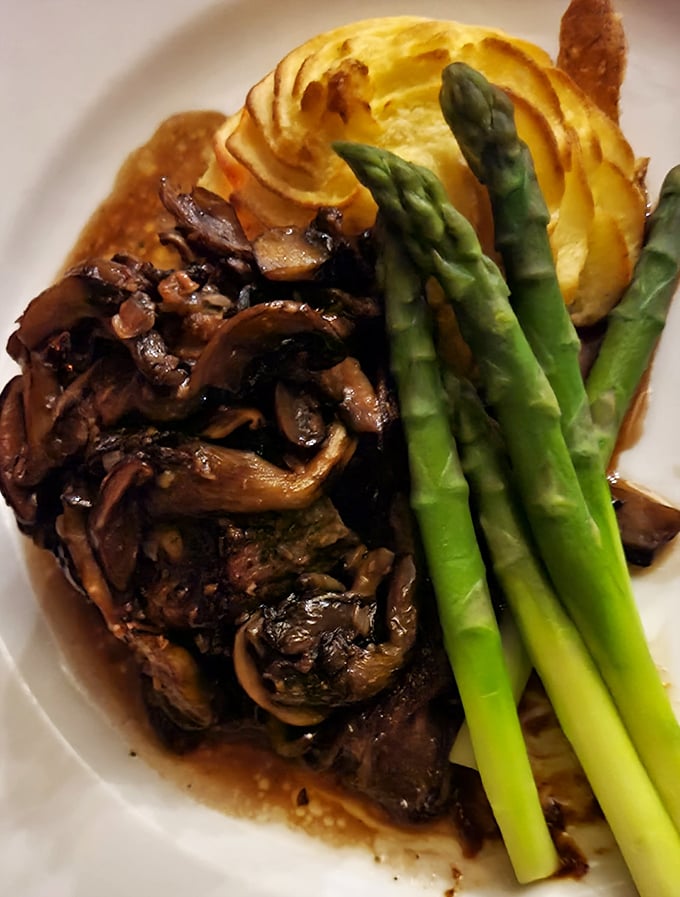 A symphony of mushrooms, asparagus, and perfectly cooked steak—proof that sometimes the most beautiful art in Pennsylvania isn't hanging in a museum.