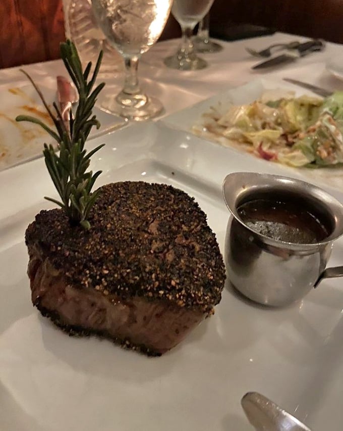 A pepper-crusted filet that's dressed for success with a sprig of rosemary. The accompanying sauce boat promises to elevate each bite to championship status.