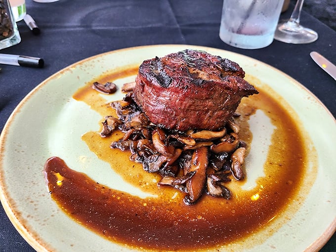 The filet mignon doesn't just sit on the plate – it reigns supreme over a kingdom of mushrooms in a pool of glorious jus.