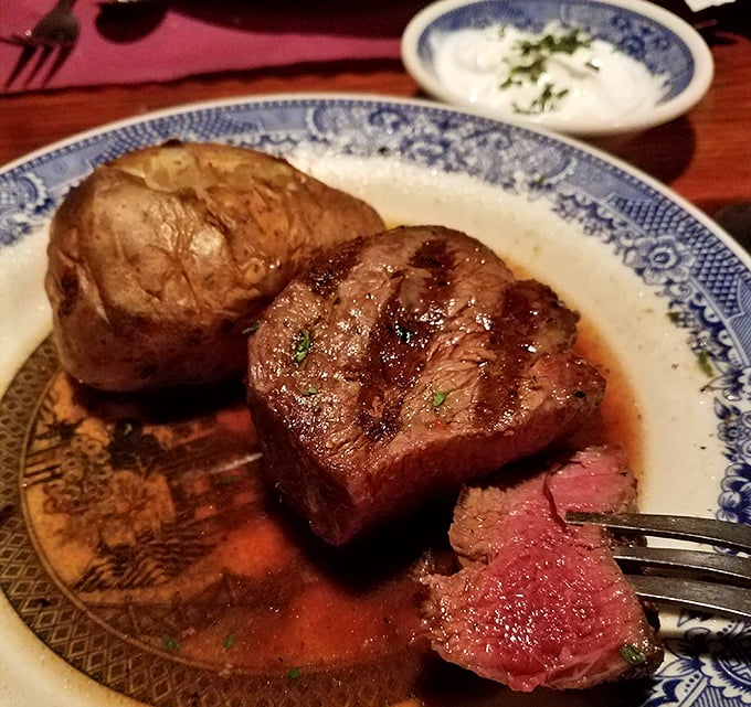 Filet mignon that would make Benjamin Franklin drop his kite—tender, juicy, and served with a potato that's practically architectural.