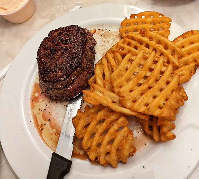 A filet mignon that doesn't need a fancy steakhouse setting to shine—just a sharp knife, waffle fries, and your undivided attention.