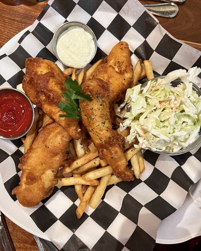 Golden-battered fish that shatters at first bite, fries worth fighting over, and slaw that isn't an afterthought—this is how fish and chips should always be.