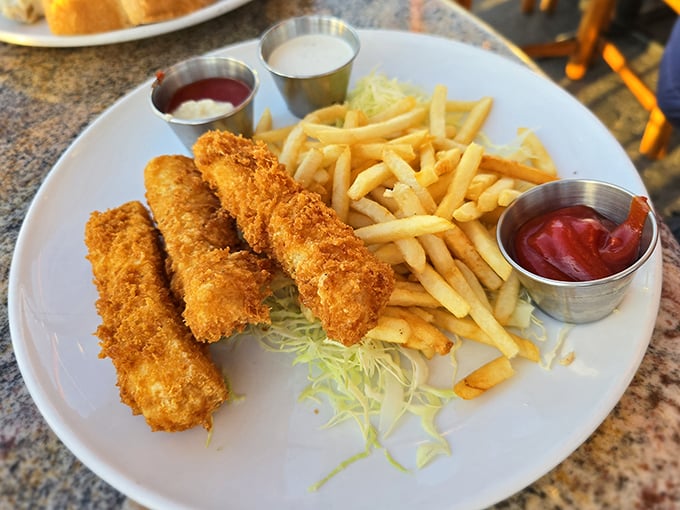 Fish and chips done right—golden, crispy perfection that would make British pub-goers nod in approval while secretly taking notes.