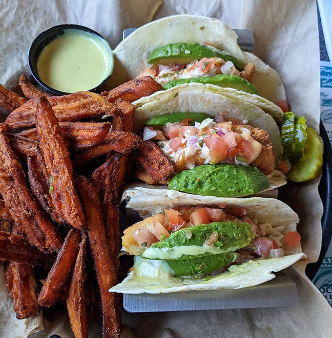 Fish tacos with sweet potato fries—proof that even classic diners know how to swim in contemporary culinary waters.