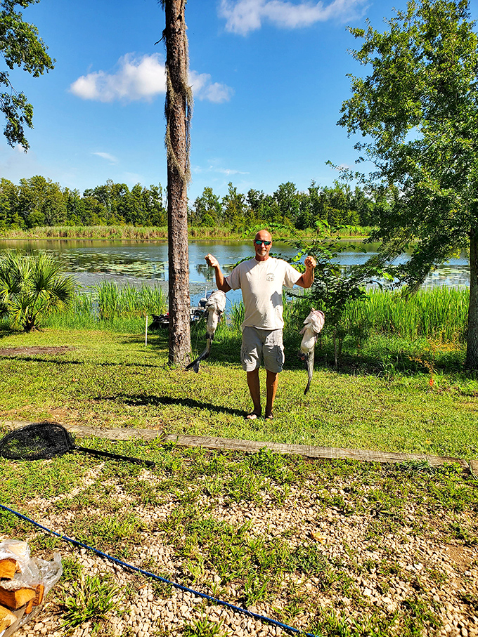 The universal language of fishing: one man, two catches, and the smile that says "dinner plans have officially changed."