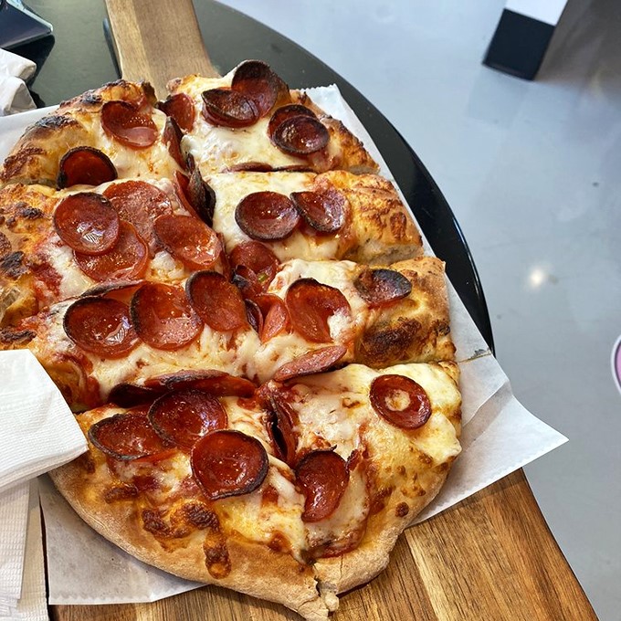 This flatbread pizza doesn't just have toppings—it has an entourage of perfectly roasted pepperoni and cheeses performing in delicious harmony.