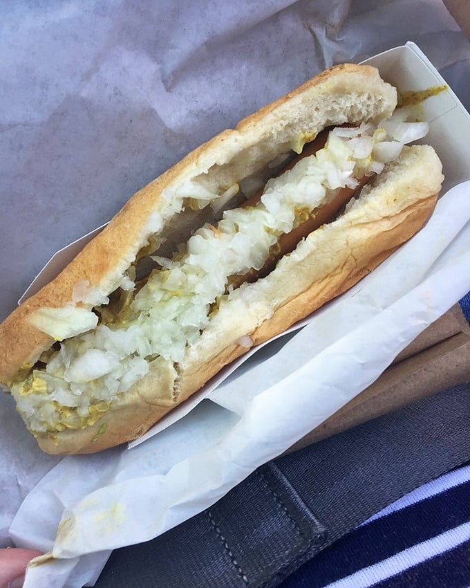 The Foot Long Slaw Dog proves that sometimes more is more – a perfect harmony of savory dog and creamy slaw that makes taste buds dance.
