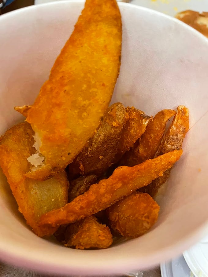 These aren't your average fries – they're the supporting actors that deserve their own Oscar, with crispy exteriors hiding fluffy potato clouds inside.