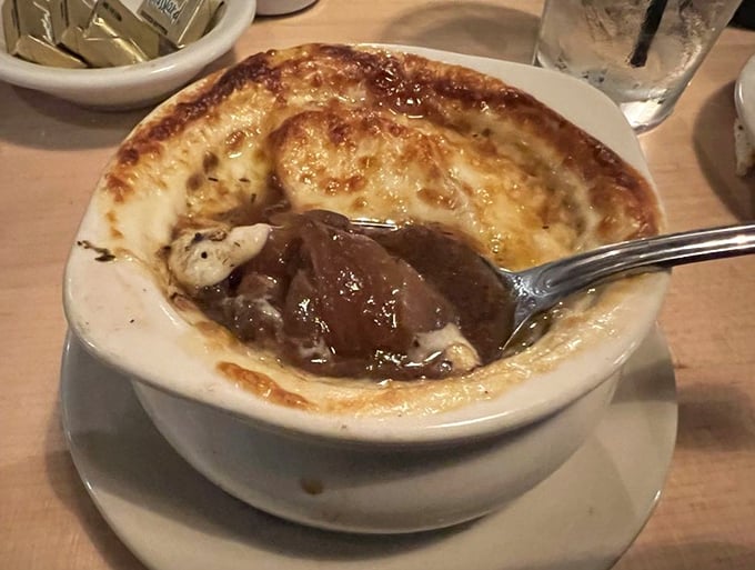 French onion soup that's worth the cheese pull struggle. The battle between your spoon and that glorious melted gruyère is one you'll happily fight.