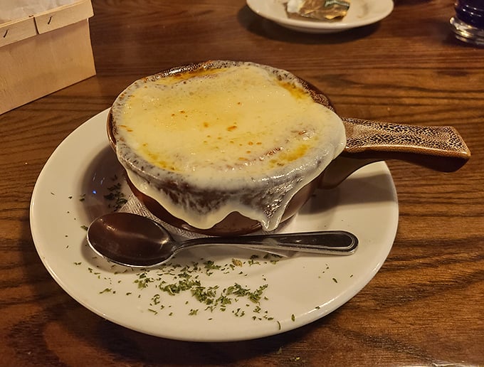 French onion soup that's more cheese than bowl – exactly as it should be. The bubbling top is practically performing a culinary standing ovation.