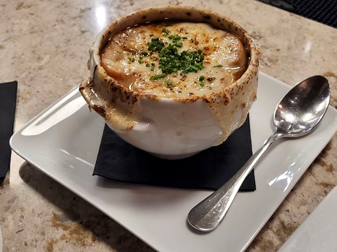 French onion soup that doesn't just warm your body—it hugs your soul. That bronzed cheese cap is practically begging for a dramatic spoon-crack moment.