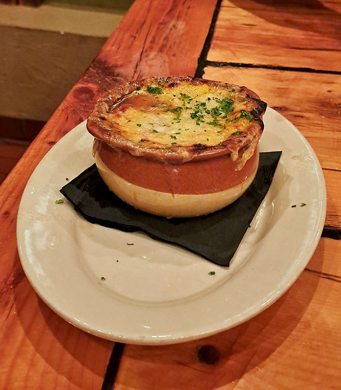 This isn't just French onion soup—it's a cheese-capped cauldron of comfort that your grandmother would approve of, if your grandmother was Julia Child.