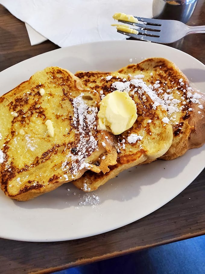 French toast that's achieved the impossible trifecta: crispy edges, custardy center, and enough butter to make Julia Child nod approvingly.