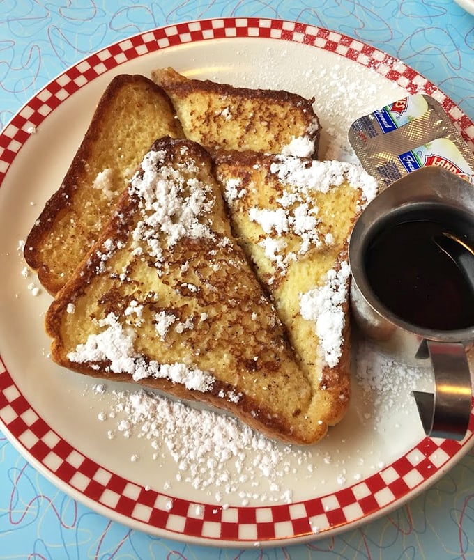 French toast dusted with powdered sugar like a light Missouri snowfall – simple, beautiful, and utterly irresistible.