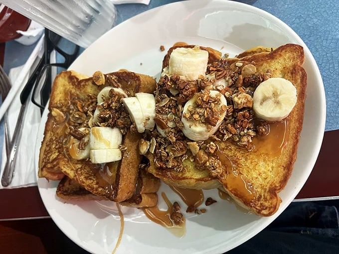 French toast so decadent it could make a grown person shed tears of joy – bananas and nuts optional, happiness guaranteed.