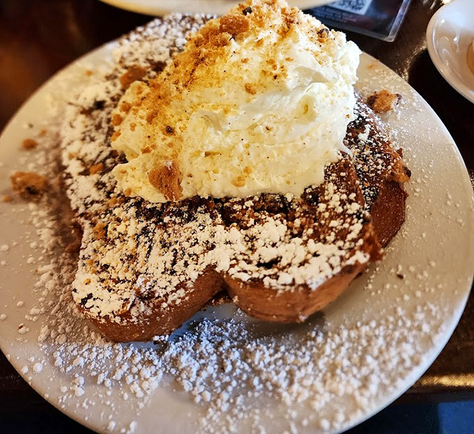French toast that's dressed for the Oscars. That mountain of whipped cream isn't just a topping—it's a lifestyle choice.