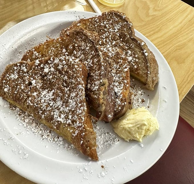 French toast that makes you question every other breakfast you've ever had. That dusting of powdered sugar isn't just garnish – it's magic.