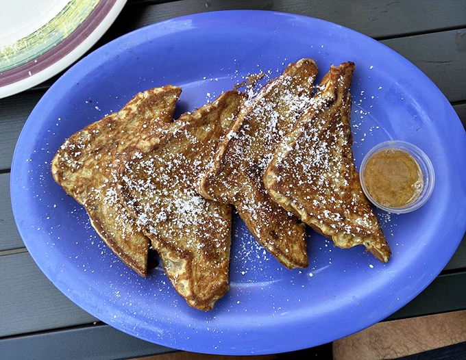 French toast that makes you question your life choices—why haven't you been eating this every morning? Dusted with powdered sugar and pure joy.