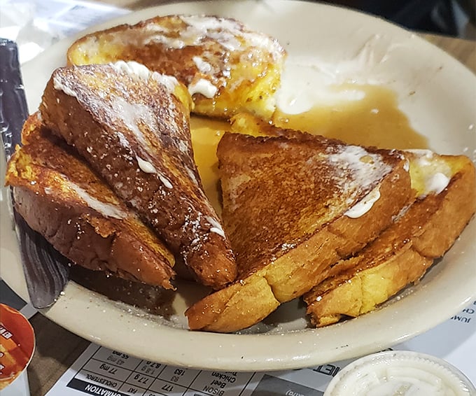Golden-brown French toast that's crispy on the edges, custardy in the middle—the kind that makes you forget about that diet you were considering yesterday.