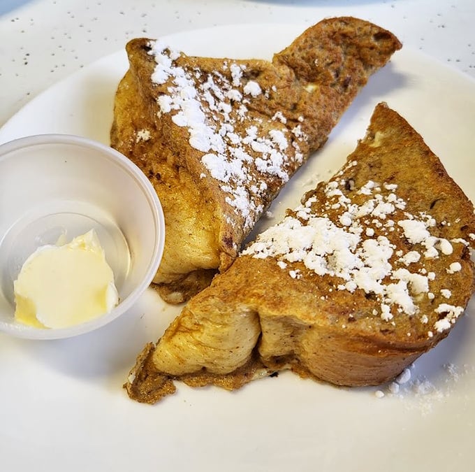 Golden-brown French toast dusted with powdered sugar—the breakfast equivalent of finding money you forgot in your pocket.