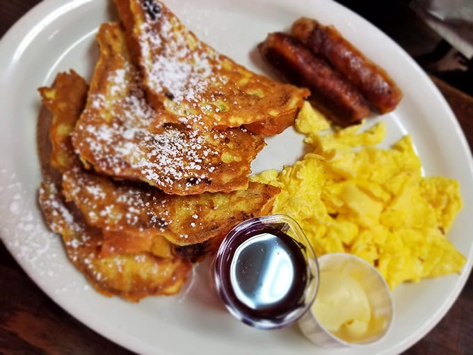French toast that makes you question every other French toast you've ever eaten. The powdered sugar isn't decoration—it's necessary balance.