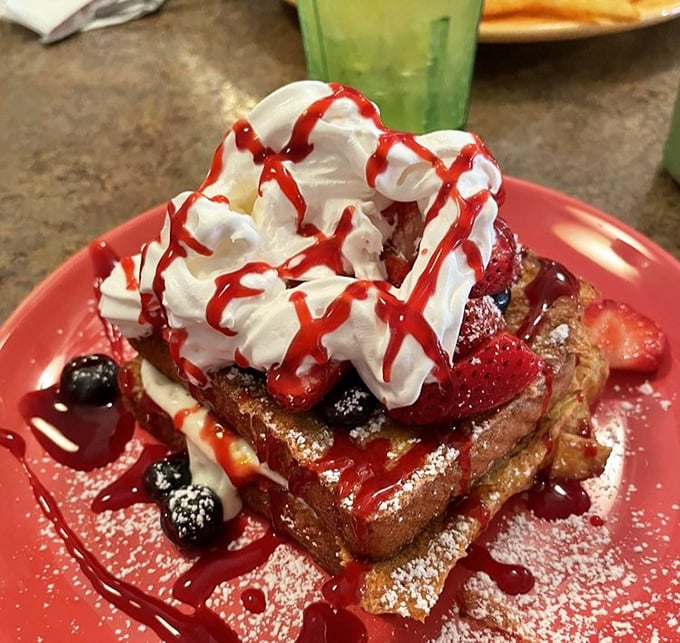 French toast that puts ordinary breakfast to shame. With berries, whipped cream, and that strawberry drizzle—it's morning decadence at its finest.