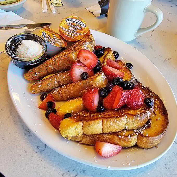 French toast that makes you question your life choices. Why have you been settling for anything less than this berry-crowned breakfast royalty?