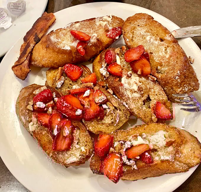 French toast that's achieved celebrity status—golden-brown, strawberry-crowned, and ready for its close-up on your Instagram feed.