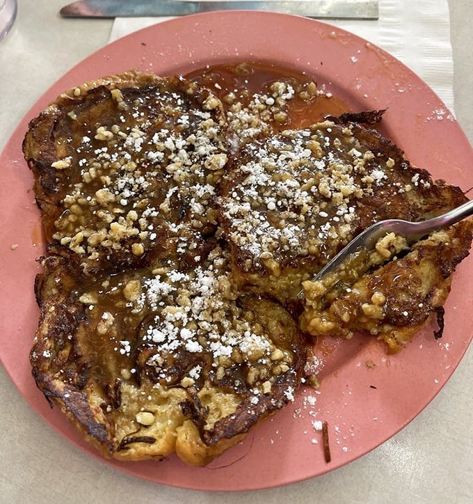 French toast that makes regular bread weep with jealousy. Those walnuts aren't just toppings—they're crunchy little flavor bombs.