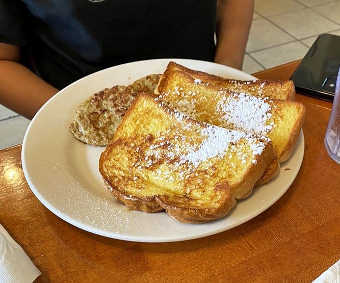 French toast that puts those fancy brunch spots to shame. Dusted with powdered sugar and golden-brown perfection, it's what breakfast dreams are made of.