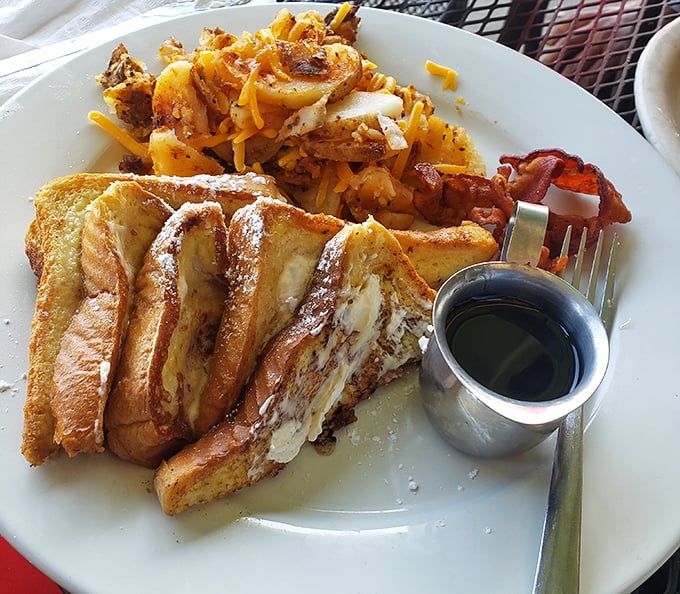 French toast that's achieved celebrity status—golden, crispy exterior giving way to a custardy center that puts ordinary bread to shame.