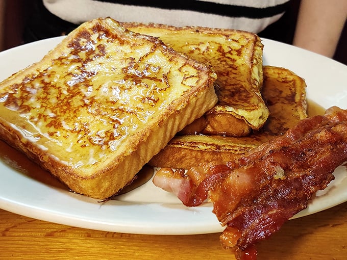French toast that's achieved that mythical balance—crispy edges, custardy centers, and bacon cooked to that perfect point between chewy and crisp. Breakfast nirvana!