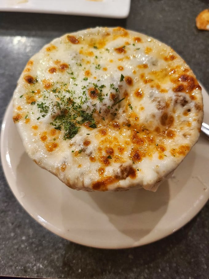 French onion soup that's achieved the perfect cheese-to-broth ratio—a bubbling masterpiece that's worth the inevitable chin dribble and temporary loss of dignity.