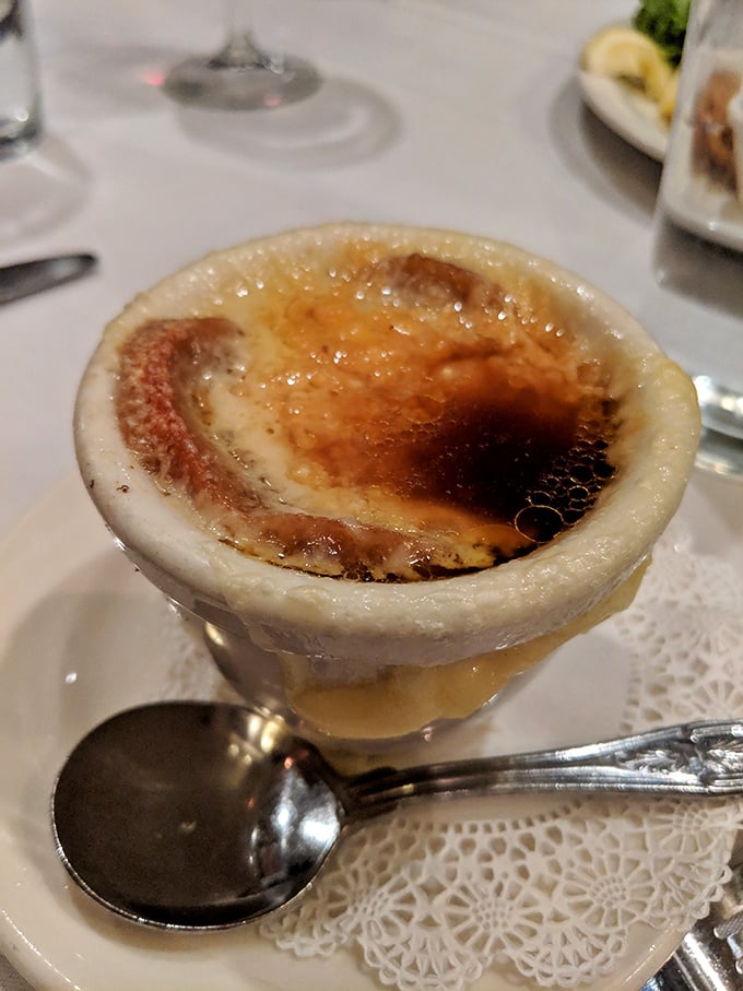 The crème brûlée's caramelized top awaits your spoon's satisfying crack. One tap and you're transported to dessert paradise.