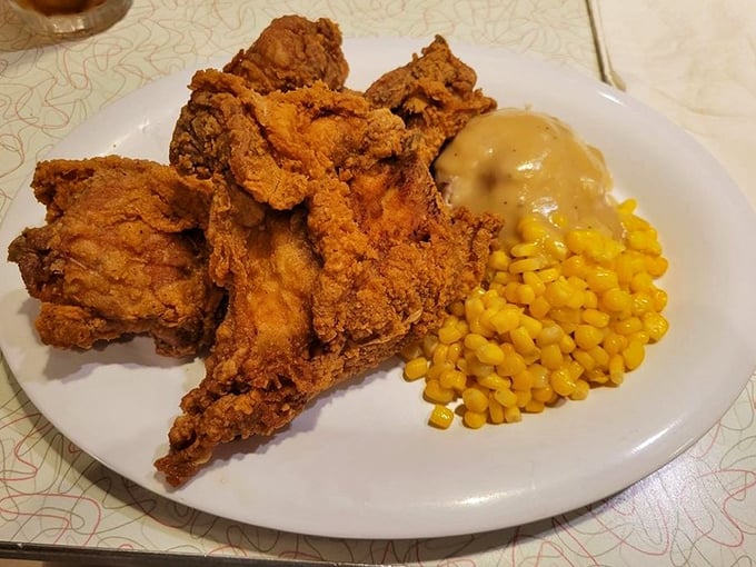 Fried chicken so golden it could fund your retirement. Paired with corn that's sweeter than the sock hop memories this place conjures up.