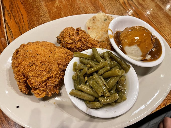 Southern fried chicken that doesn't need a fancy introduction – just perfectly seasoned crust protecting juicy meat, with sides that refuse to be overshadowed.