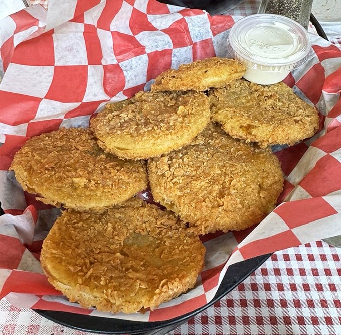 Fried green tomatoes with the perfect golden crust—crispy, tangy discs of Southern charm that would make Fannie Flagg herself stand up and applaud.