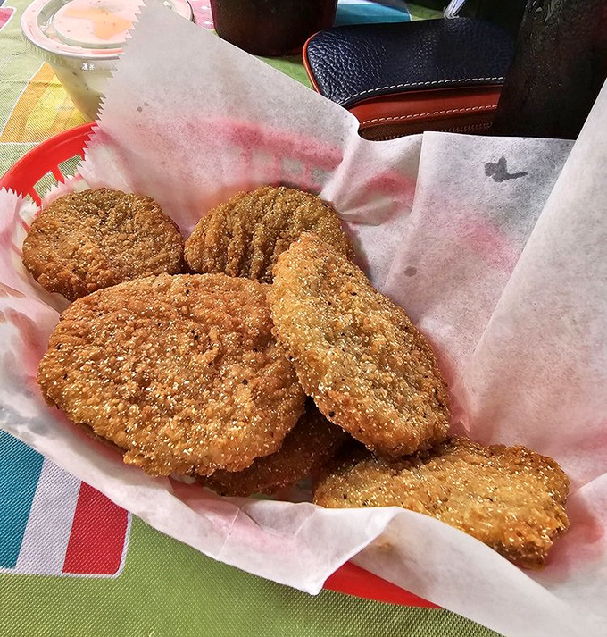 Fried green tomatoes that would make Fannie Flagg weep with joy—crispy, tangy discs of Southern comfort that vanish faster than Texas rain.