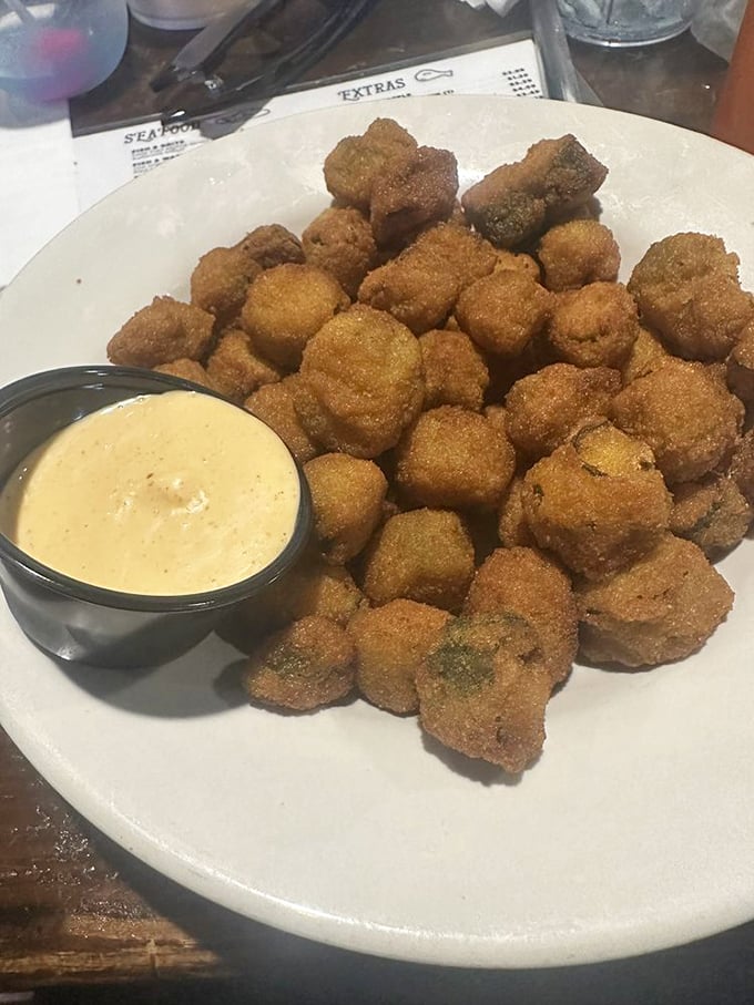 These crispy nuggets of fried okra aren't just a side dish—they're little Southern ambassadors of happiness, especially when dunked in that creamy sauce.