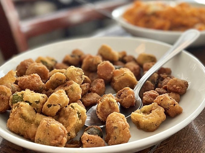 Fried okra that defies the vegetable's slimy reputation—crispy, golden nuggets that convert skeptics faster than a revival meeting.