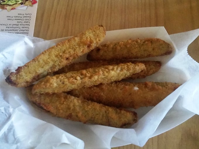 These aren't your average pickles. They've been transformed into golden, crispy vessels of tangy delight that would make even pickle skeptics reconsider.