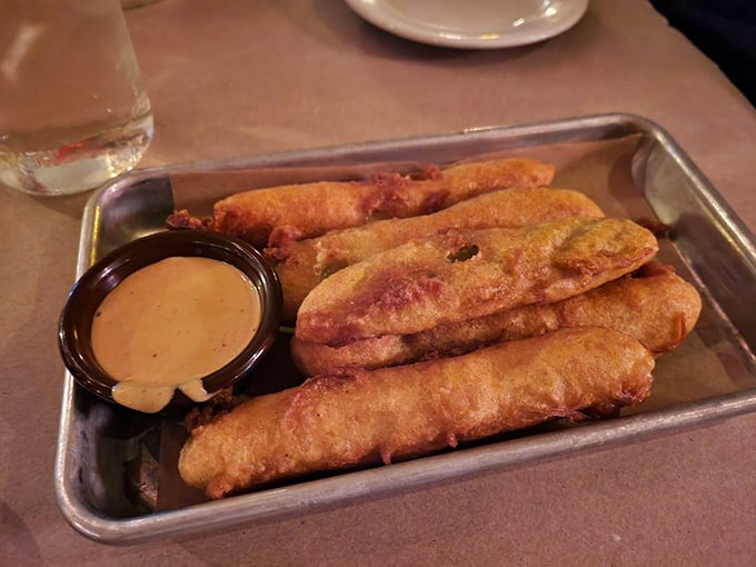 Crispy on the outside, tangy on the inside—these fried pickles with dipping sauce are the opening act that threatens to steal the whole show.