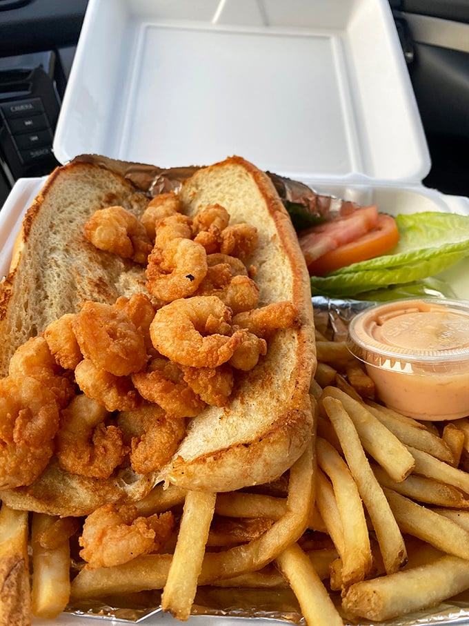 This po'boy isn't poor in flavor—golden fried shrimp spilling out of soft bread with crispy fries standing by for backup.