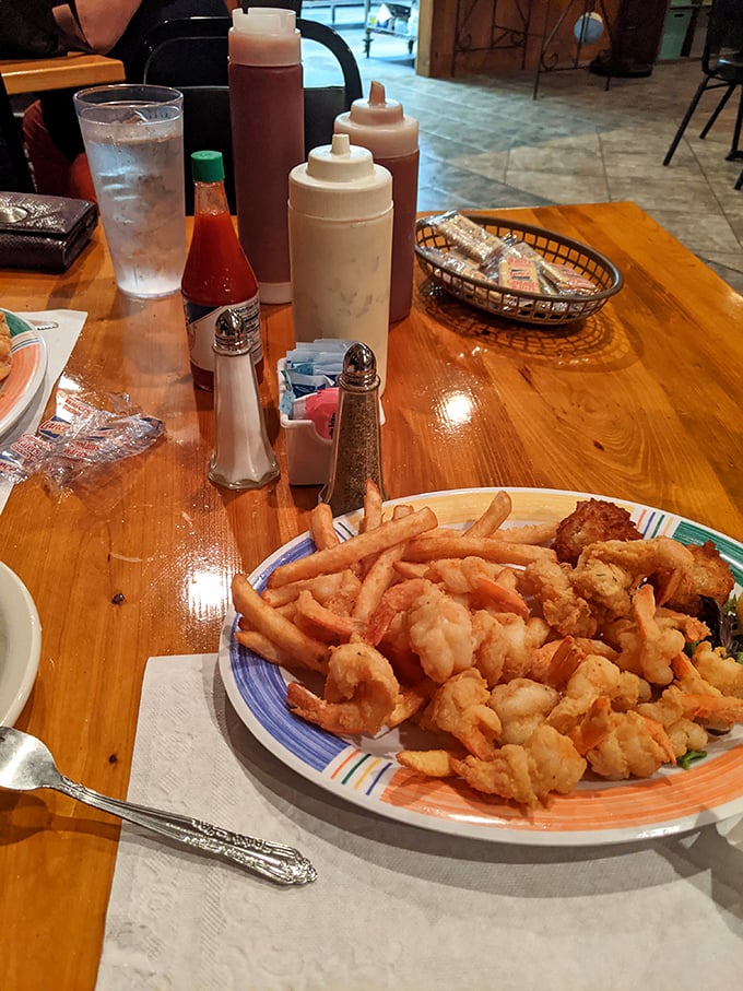 Golden-fried shrimp and crispy fries—proof that sometimes the simplest pleasures deliver the most profound satisfaction.