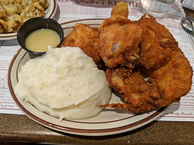 The holy grail of fried chicken—golden, crispy exterior giving way to juicy meat within. The mashed potatoes aren't just a side; they're a necessity.