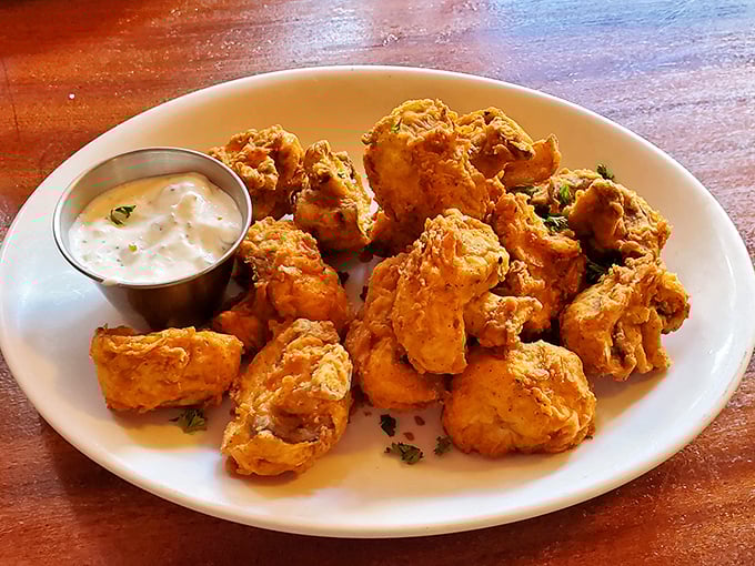 These aren't just fried mushrooms; they're golden orbs of happiness that somehow make vegetables feel like an indulgence.