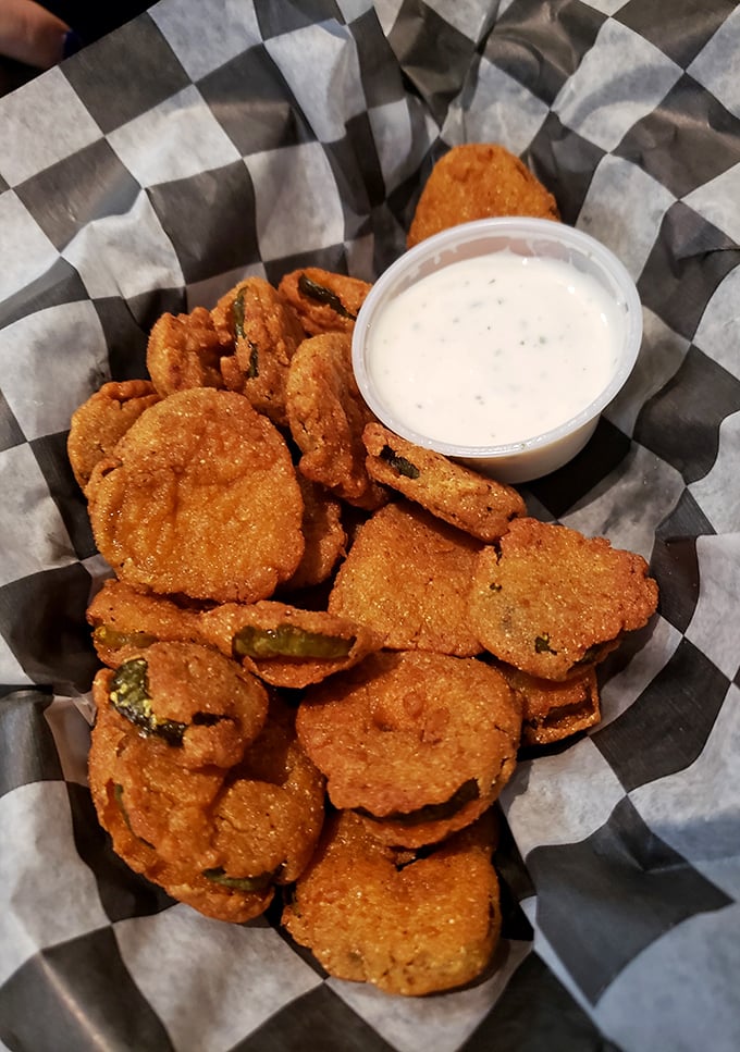 These aren't your average pickle chips. Perfectly breaded, crispy-fried dill slices with ranch dressing—the snack that launched a thousand cravings.