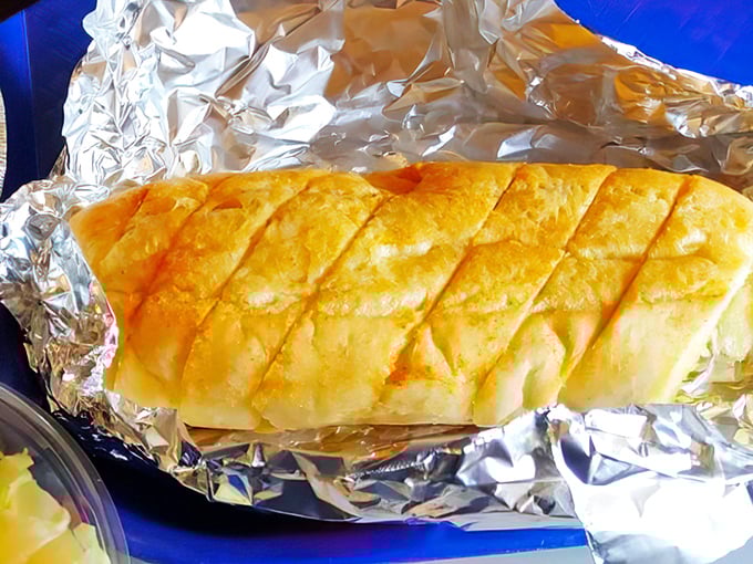 Garlic bread that's achieved the golden-brown perfection we all aspire to in life—crisp edges, soft center, and zero regrets.